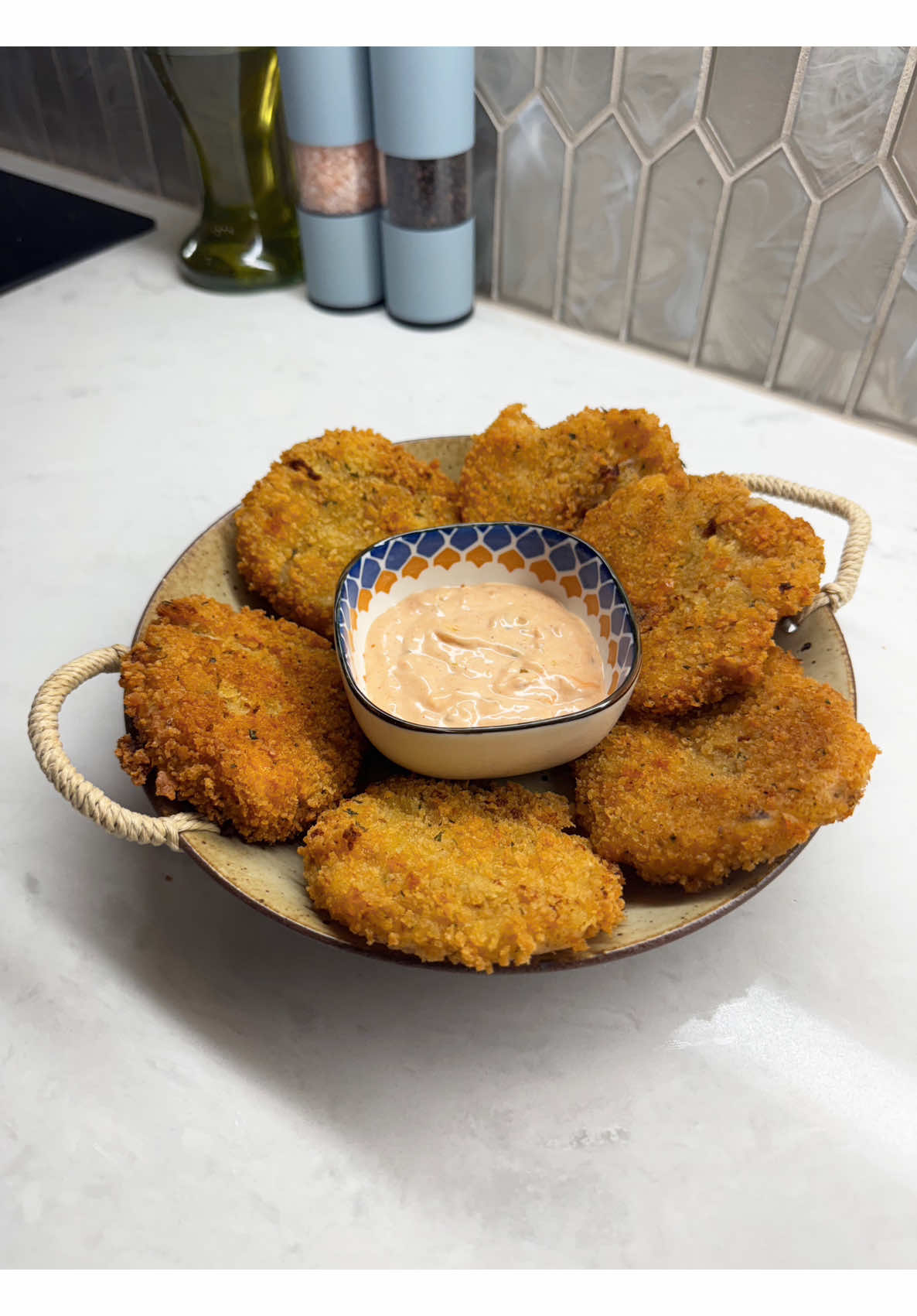 Making crispy fried fritters served with a rich sauce for the perfect ...