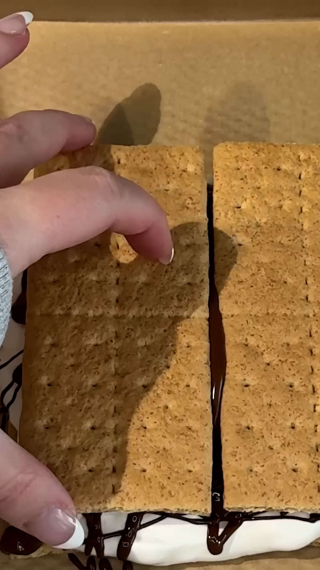 S'mores layers stacked and frozen into a handheld ice cream sandwich ...